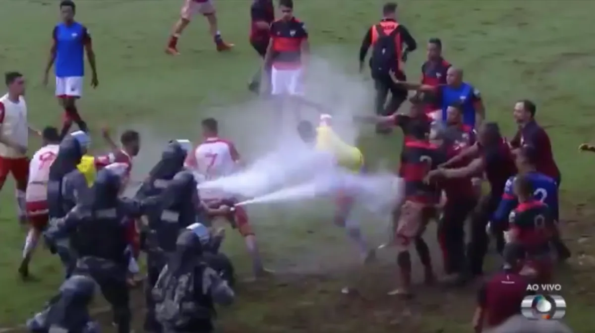 Brazilian football match descends into mass brawl as police use pepper ...