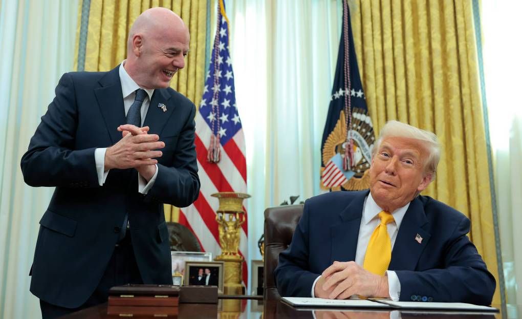 Donald Trump hangs his infamous mugshot outside the Oval Office